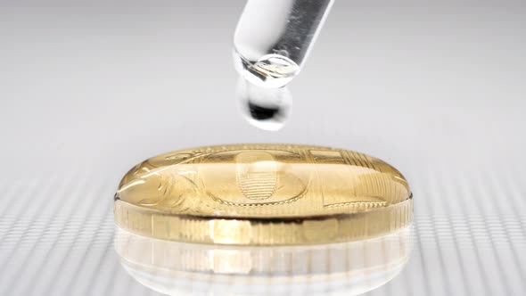 A Coin with Water Shows the Surface Tension of the Water, Stock Footage