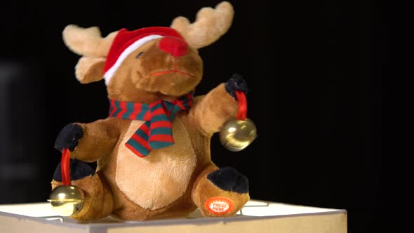 A Dancing Plush Christmas Reindeer Toy with Jingle Bells - Closeup ...