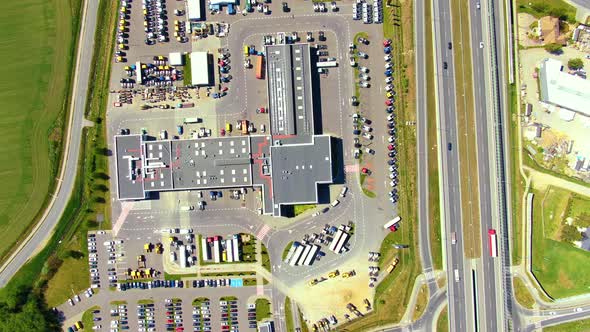 Aerial Shot of Industrial Loading Area where Many Trucks Are Unloading ...