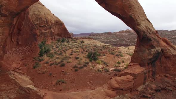 Drone flying through Funnel Arch in Moab, Stock Footage | VideoHive