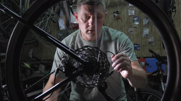 Service Engineer Performs Diagnostics and Repairs of Bicycle in ...