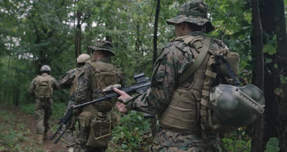 Soldiers Moving Through Forest During Tactical Action Concept of War ...