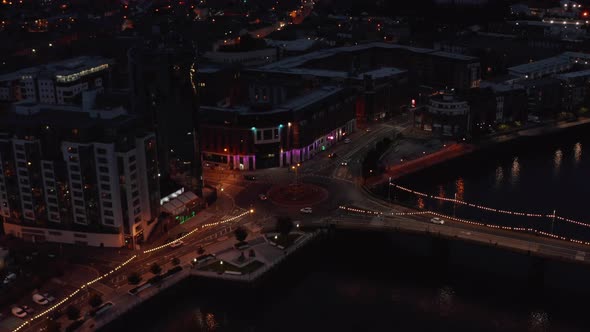 Aerial View of Cars Driving Through Roundabout at River Waterfront ...