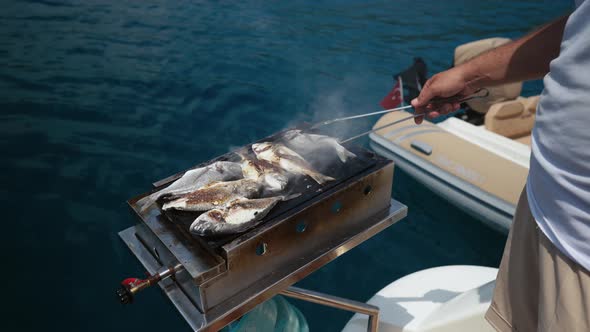 Closeup of Preparing Grilled Sea Bass Fish Outdoors in the Open Sea ...