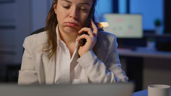 Concentrated Businesswoman During Phone Call Late at Night, Stock Footage