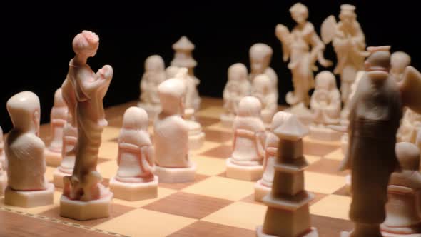 Chessboard rotating during a chess game, Camera slowly move towards ...