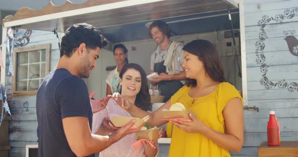 Smiling friends eating snacks, Stock Footage | VideoHive