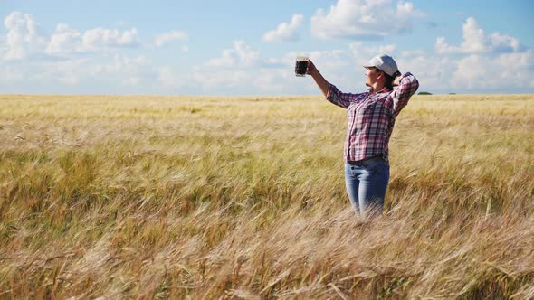 Farmer Drink Dark Beer in Barley Field, Stock Footage | VideoHive