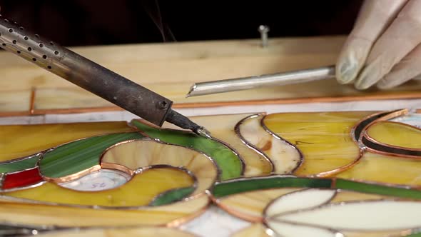 Solder and Soldering Iron with a Stained Glass, Stock Footage | VideoHive