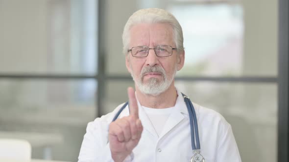 Portrait of Senior Old Doctor Showing No Sign By Finger, Stock Footage