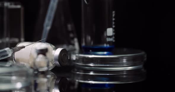 Laboratory Equipement: Syringe and Medicine, Test Tubes and Flasks ...