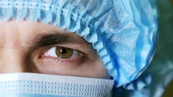 Macro Close Up of Man's Surgeon Eye, Doctor with Face Mask Ready for ...