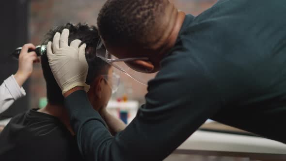 AfricanAmerican Biologist Examines Man Hair and Head Skin, Stock Footage