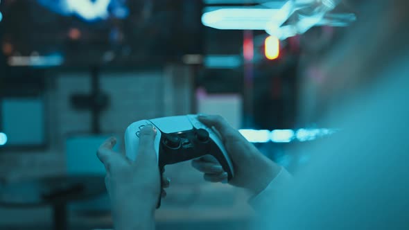Young Female Gamer Playing Console in Neon Room, Stock Footage | VideoHive