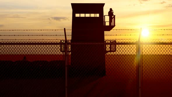 Soldier Standing Guard in Military Watchtower and Sunset View, Motion ...