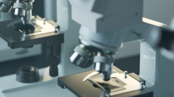 Countless modern microscopes in a row analysing samples in an endless ...