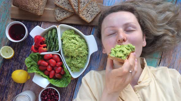 Young Smiling Woman Eating Avocado Toast At Home., Stock Footage ...