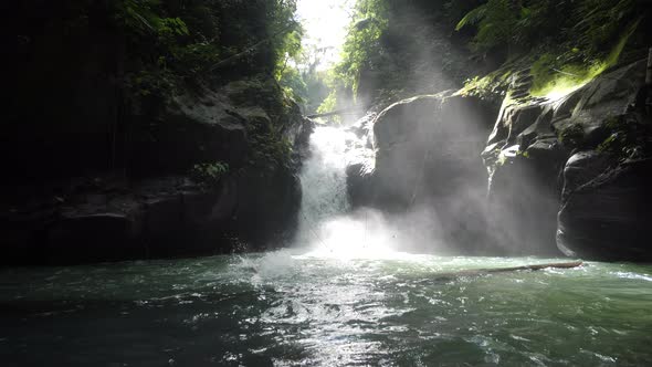 Caucasian Guy Jumps and Swim in the Tropical Rainforest Waterfall at ...