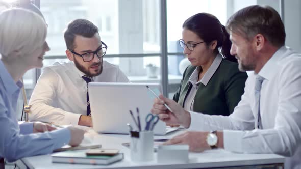 Business Partners Cooperating at Meeting, Stock Footage | VideoHive