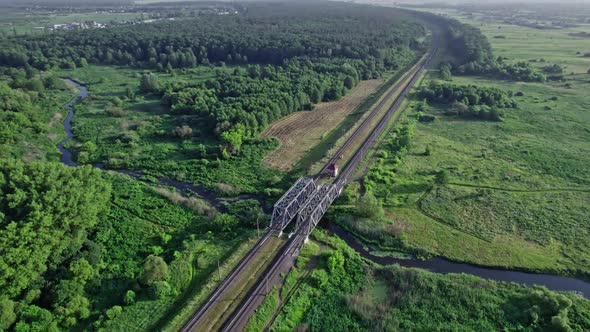 Railway Bridge in Countryside Passing Above Small River, Stock Footage