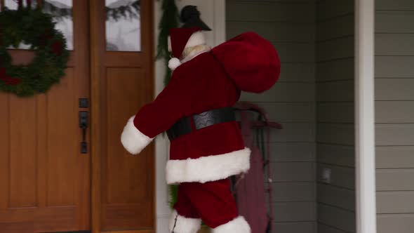 Santa Claus going into front door of home, Stock Footage | VideoHive