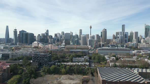Aerial shot of Sydney City center in the morning, drone moving up over ...