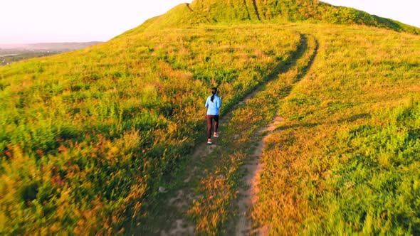 Aerial View Woman Athlete Running on the Hill, Stock Footage | VideoHive