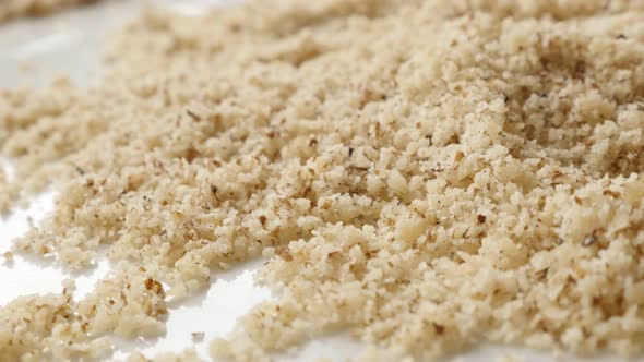 Slow pan on grinded nuts food ingredient background 4K 2160p 30fps ...