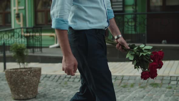 Closeup Man Going on Date with Bouquet. Man Smelling Red Roses at Paved ...
