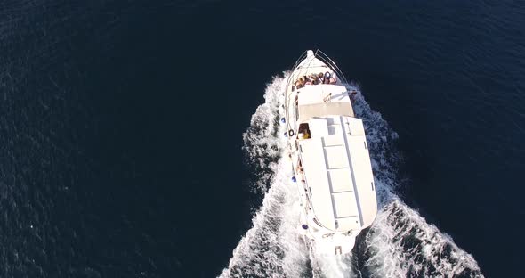 White Motor Boat with Tourists at the Stern Floats on the Sea, Stock ...
