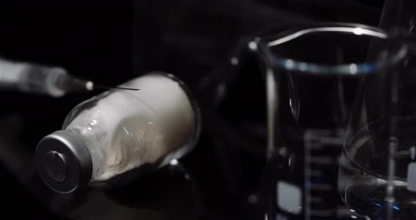 Laboratory Equipement: Syringe and Medicine, Test Tubes and Flasks ...