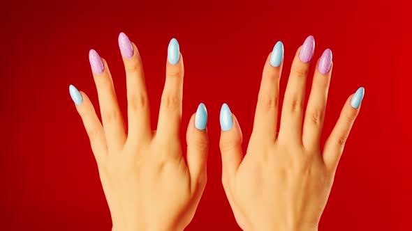 Woman's Hands with Beautiful Nails on Red Background, Stock Footage
