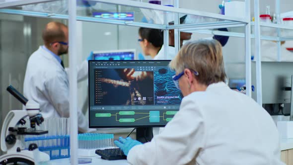 Medical Research Scientist Typing Codes on Computer, Stock Footage