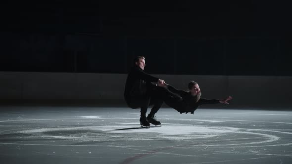 Pair of Figure Skaters is Performing Lift with Spinning Training in ...