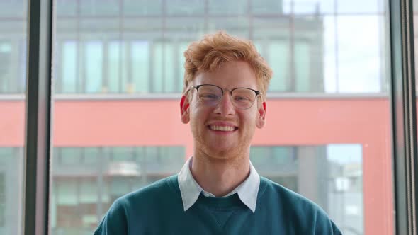 Young Ginger Irish Man in Glasses Crossing Hands on Chest Portrait ...