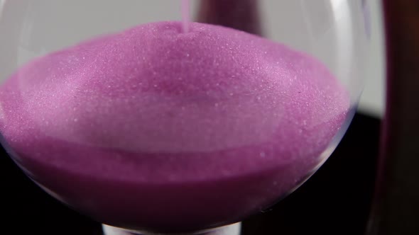 Thin Trickle of Sand Forms a Hill in the Hourglass. Close Up, Stock Footage