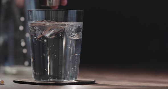 Slow Motion Man Pour Syrup in Tonic in Tumbler Glass on Walnut Table ...