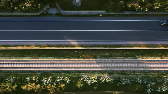 Light Traffic on a Road That Runs Parallel to a Train Railway, Stock ...