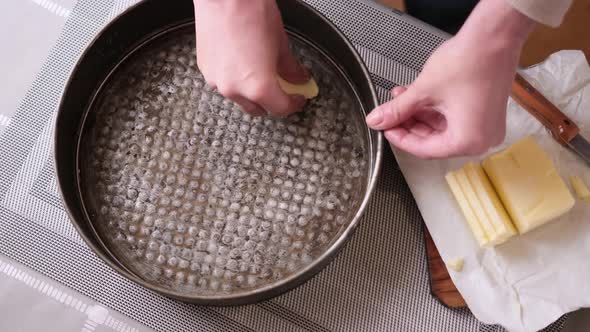 Closeup Video of Woman Buttering a Cake Pan for Baking Cake, Stock Footage