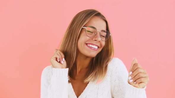 Young Woman is Dancing Snapping Fingers and Smiling While Posing ...