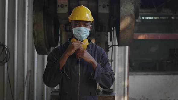 engineer remove mask from face at work in industry factory, Stock Footage