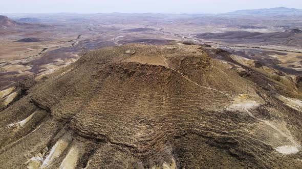Aerial orbit and zoom out of Mount Ramon and reveal of the Ramon Crater ...