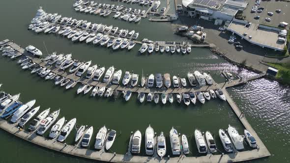 Luxury boathouse boat parking in rows at the port. Aerial top down ...