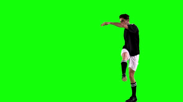 Athlete practicing soccer against green screen by Wavebreakmedia ...