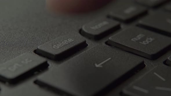 The Finger Presses the Backspace Button on the Keyboard, Stock Footage