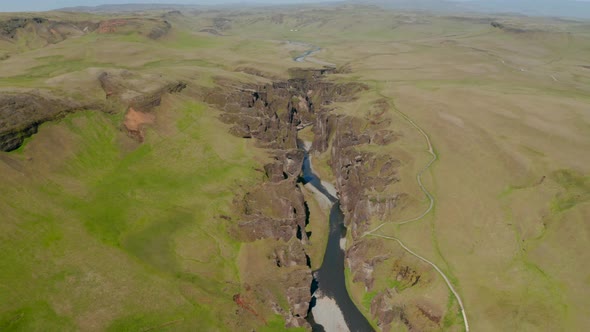 Aerial Shot of Creek Flowing From Ravine with Rugged Rock Walls, Stock ...