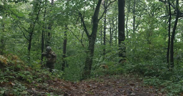 Soldiers Moving Through Forest During Tactical Action Concept of War ...
