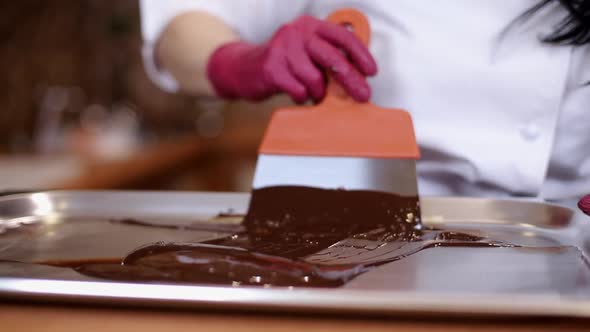 Confectioner is Working with Melted Chocolate Using Putty Knife, Stock ...