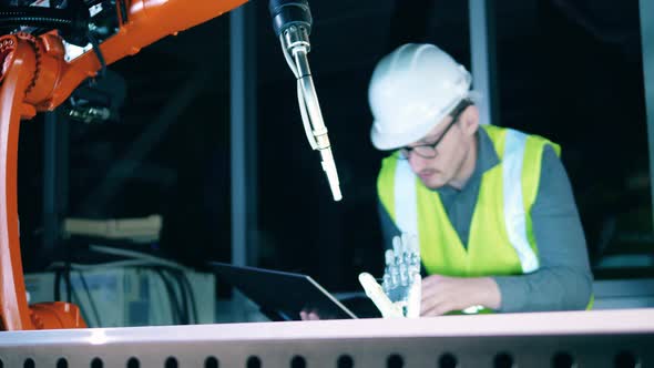 Bionic Mechanisms Under Observation of a Construction Engineer, Stock ...