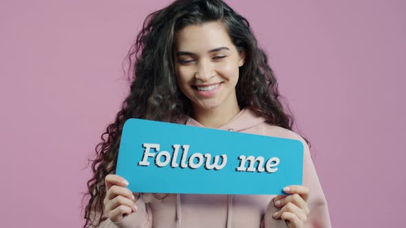 Portrait of Cute Blogger Showing Follow Me Sign Attractive Subscribers ...